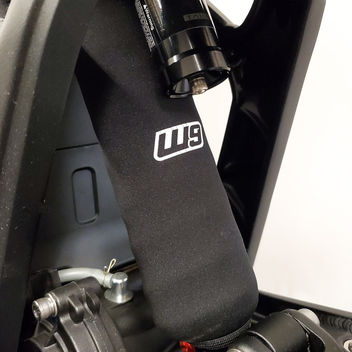 E-moto Shock Cover – Elektrisches Racing